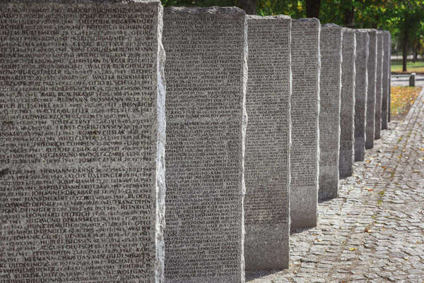 identical stone tombs with lettering placed in row at graveyard - Stock ...