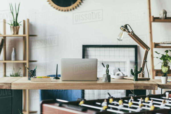 Open laptop on wooden table in modern office interior - Royalty-free ...