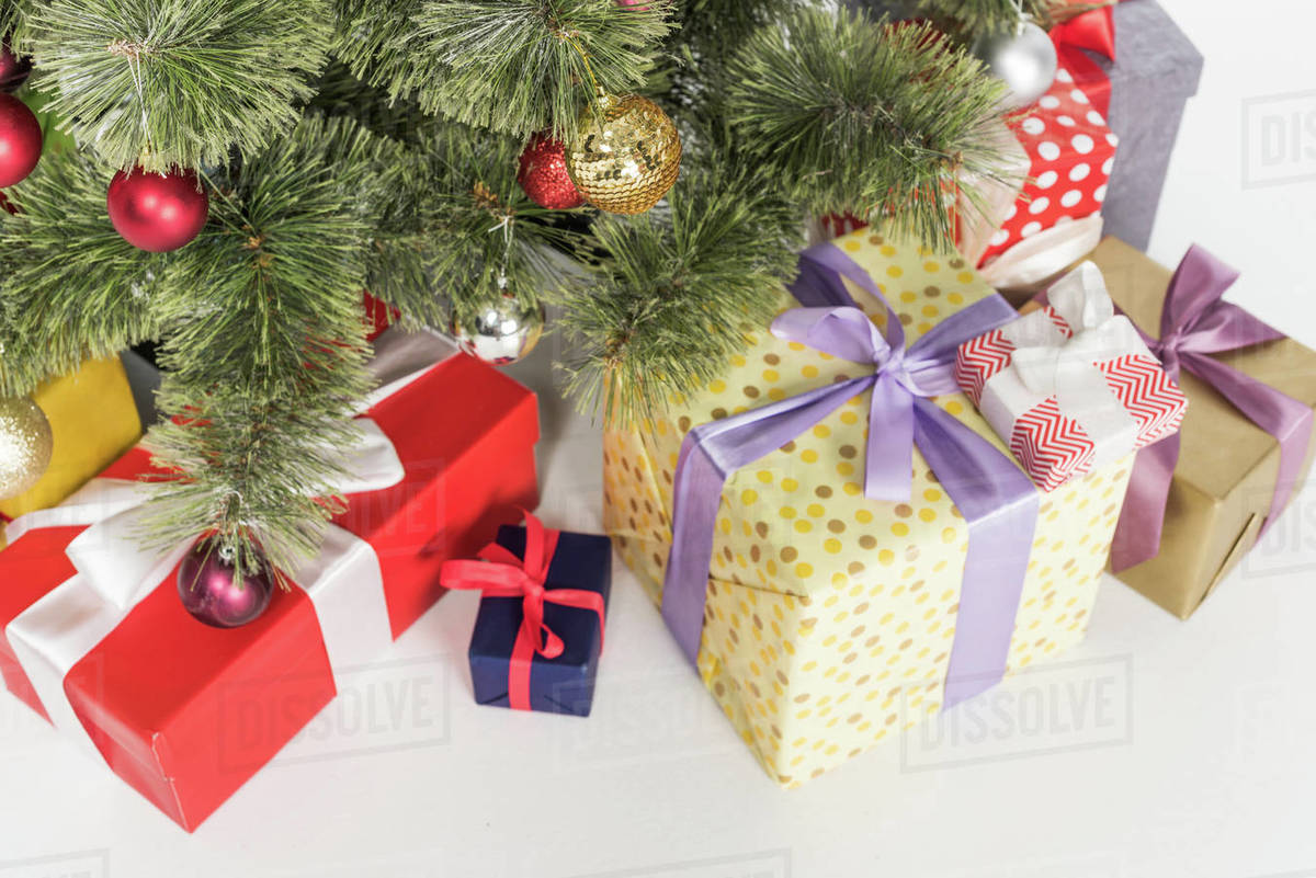 Close up view of wrapped presents under Christmas tree isolated on ...