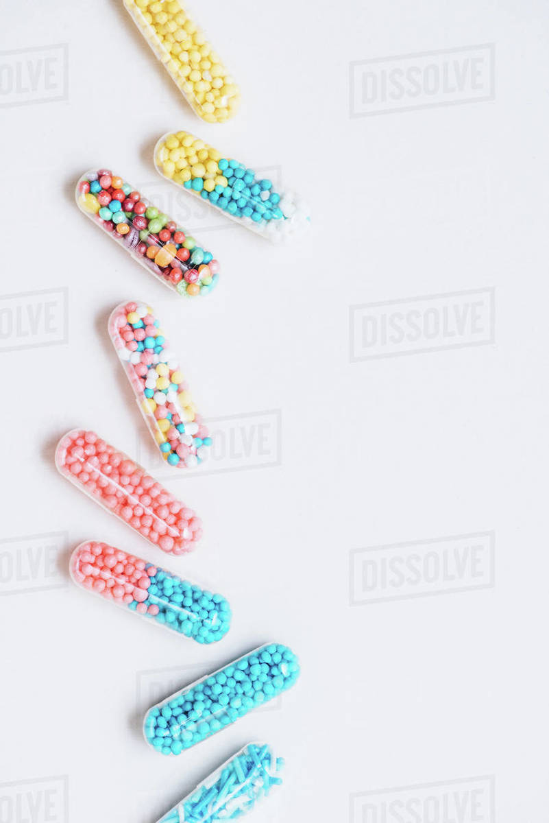 Top view of various colorful medical capsules on white - Stock Photo ...
