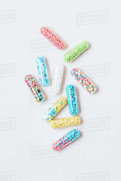 Top view of different colorful medical capsules on white - Stock Photo ...