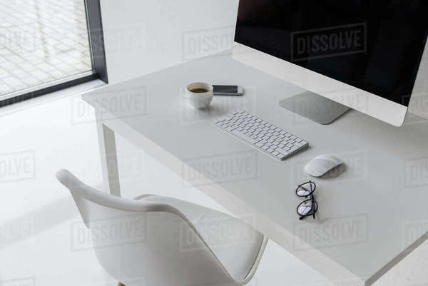 Workplace with computer in modern office with white wall and furniture ...