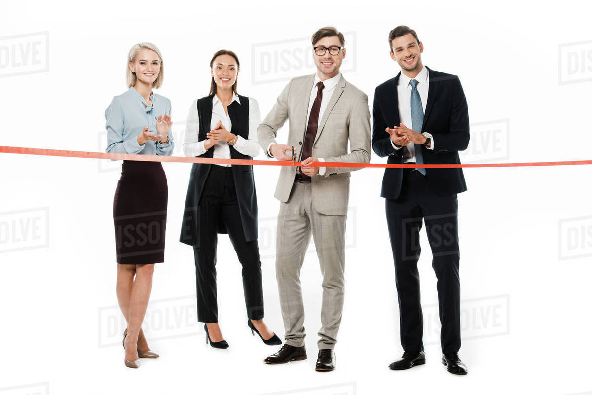 professional leader cutting red ribbon on opening ceremony while ...