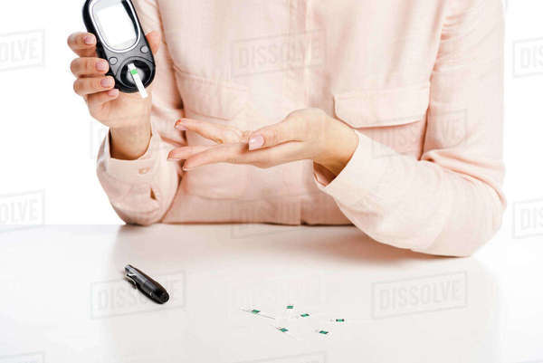 cropped image of girl measuring level of glucose in blood with ...