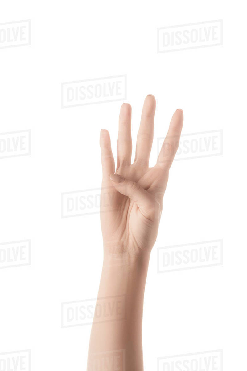 Partial view of woman showing number 4 in sign language isolated on ...