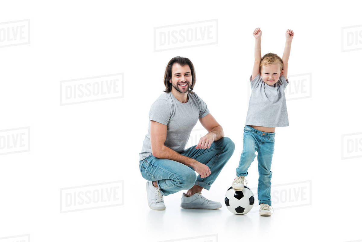 happy father and excited son playing football isolated on white ...