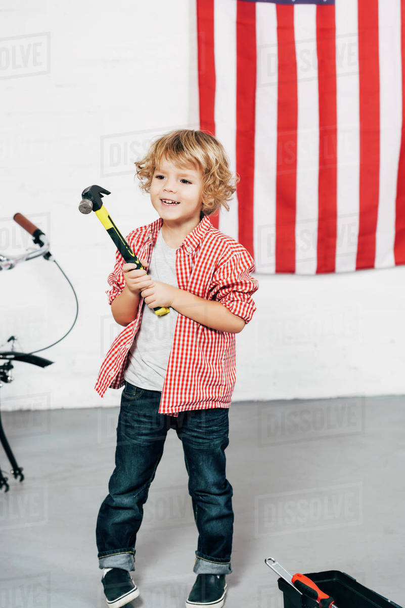 Selective focus of happy adorable boy holding hammer - Royalty-free ...