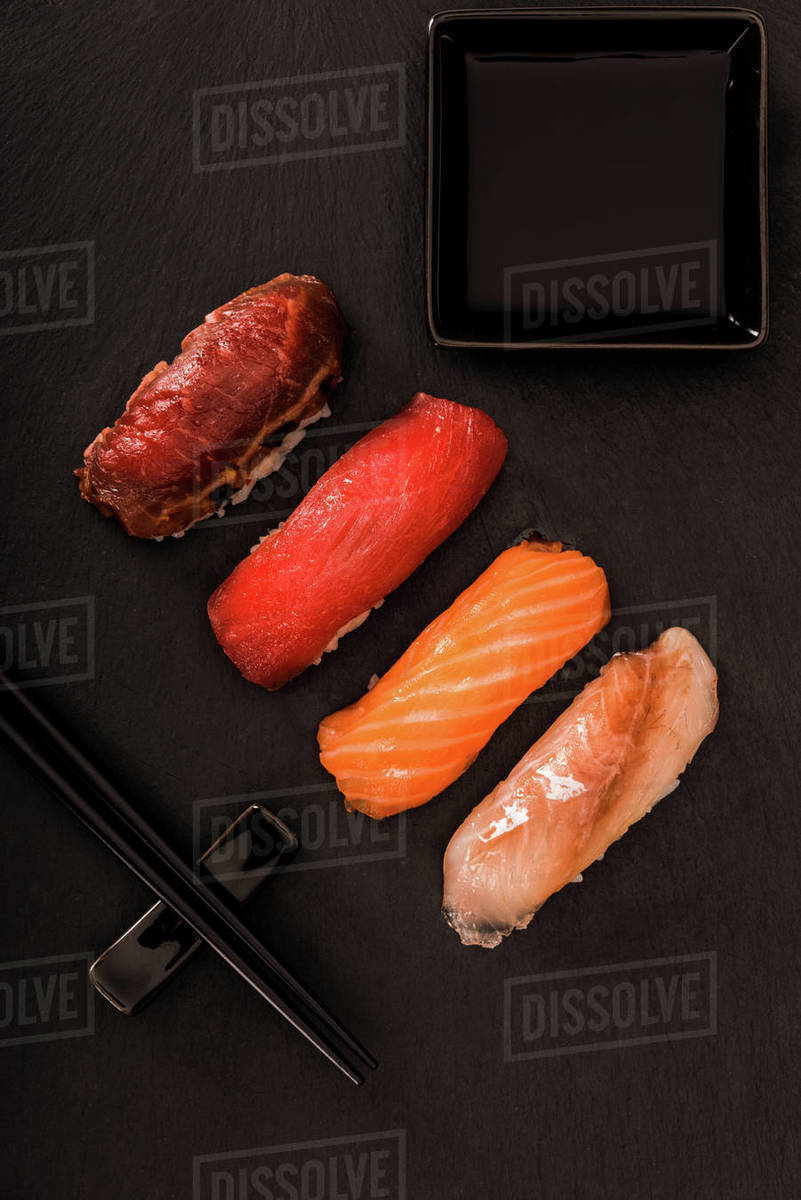 Top view of delicious sashimi sushi on black slate - Royalty-free Stock ...