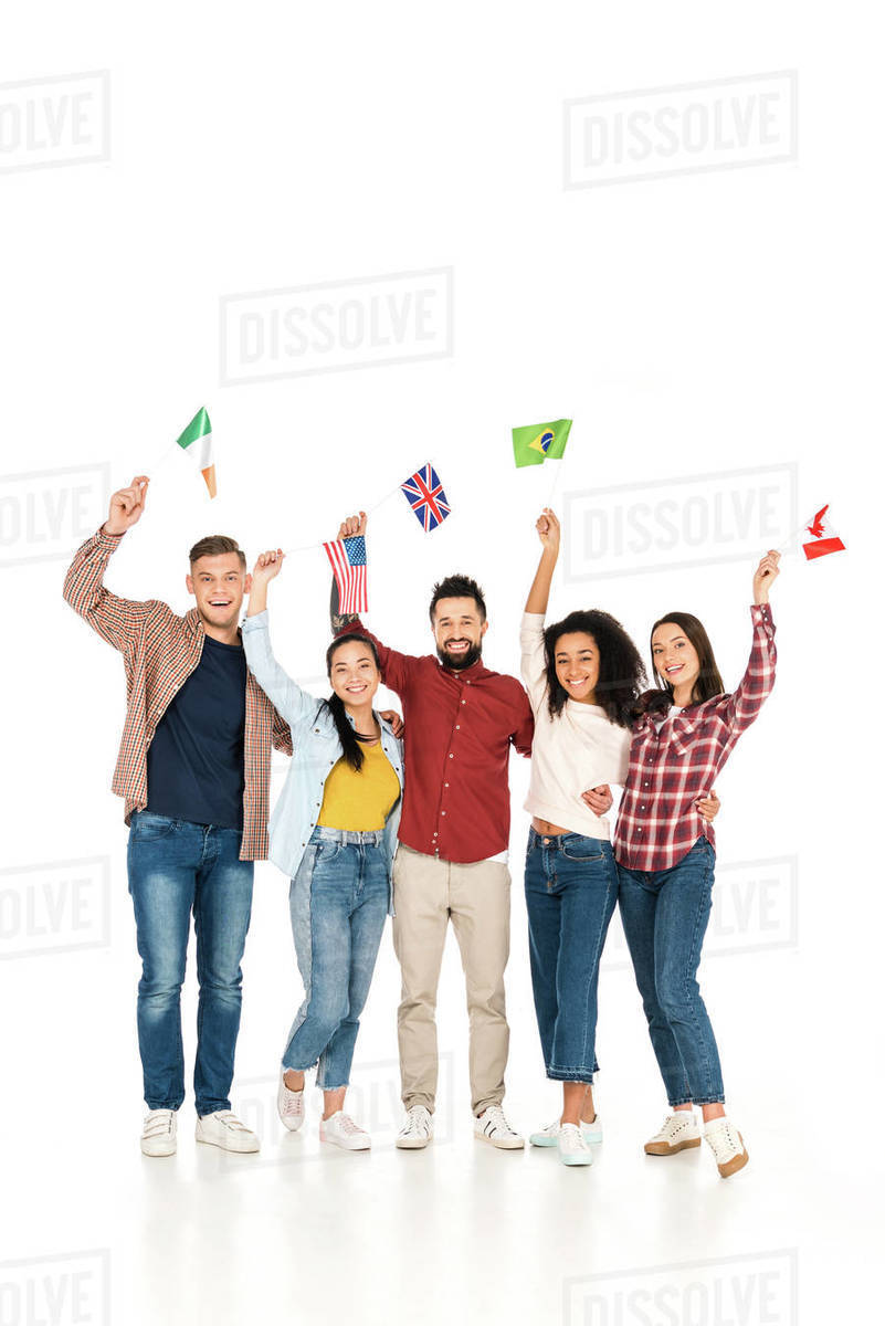 Cheerful multicultural group of people smiling with flags of different ...