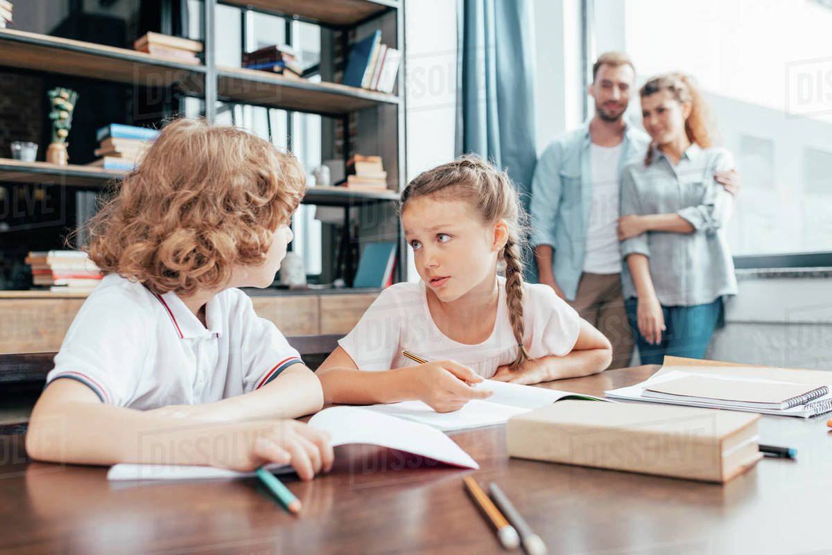 Cute little kids doing homework together - Royalty-free Stock Photo ...