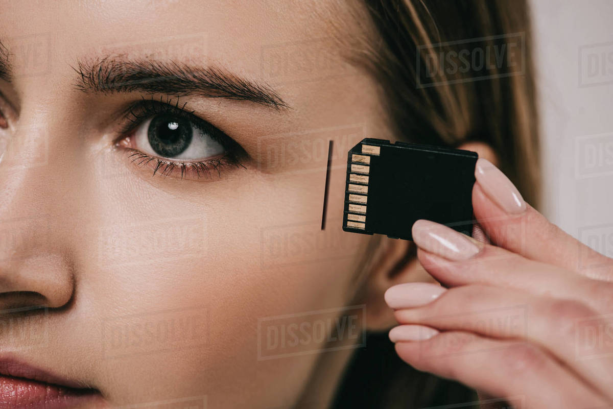 Cropped view of woman implanting microchip in head - Royalty-free Stock ...