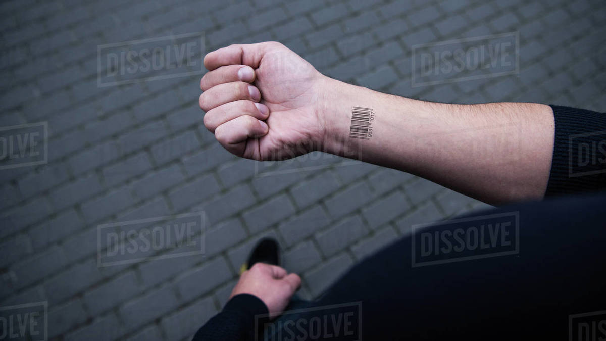 Cropped view of barcode on male hand with bricks on background - Stock ...