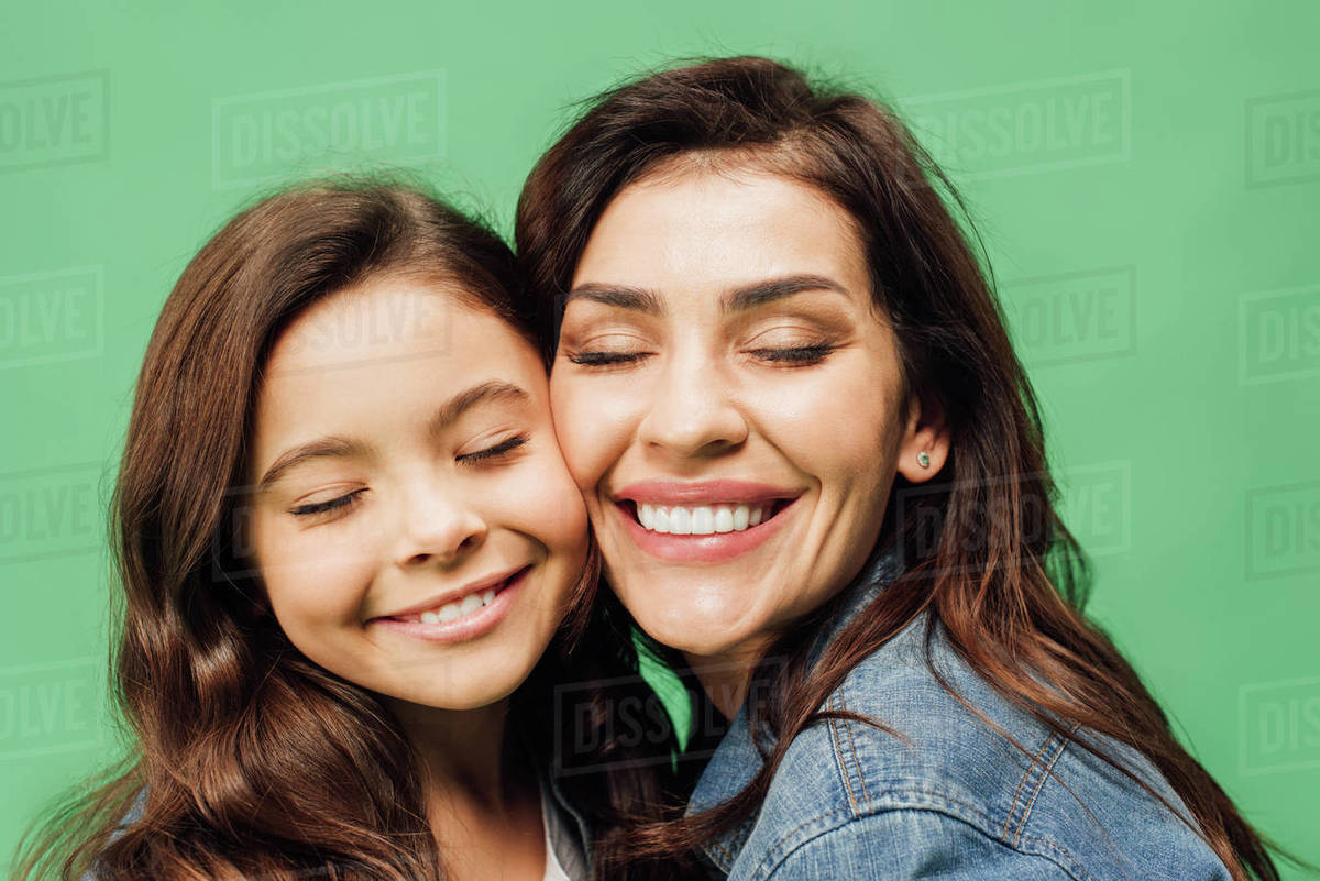 Portrait of happy mother and daughter with eyes closed - Royalty-free ...