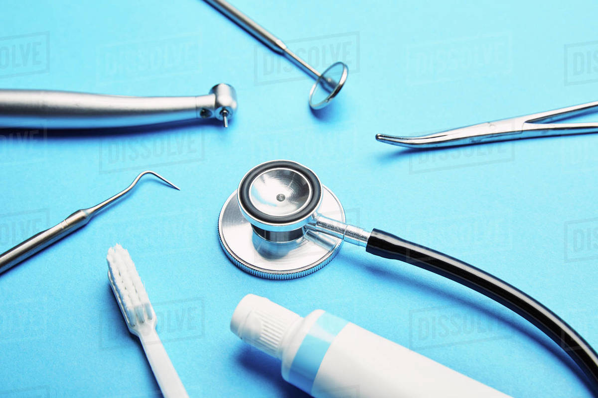 Close up view of arrangement of sterile dental instruments, stethoscope ...