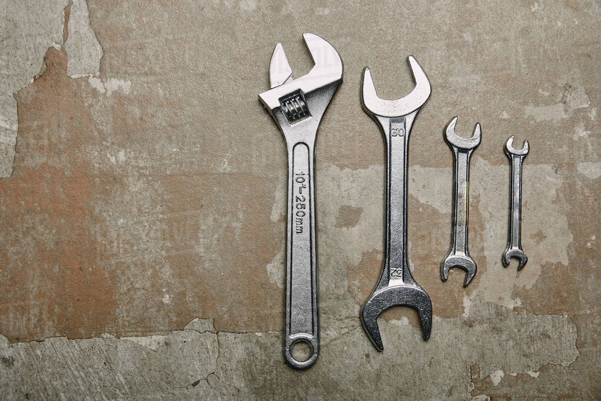 Top view of set of wrenches tools and one monkey wrench on the ...