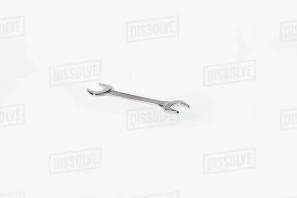 Silver colored wrench tool isolated on white - Stock Photo - Dissolve