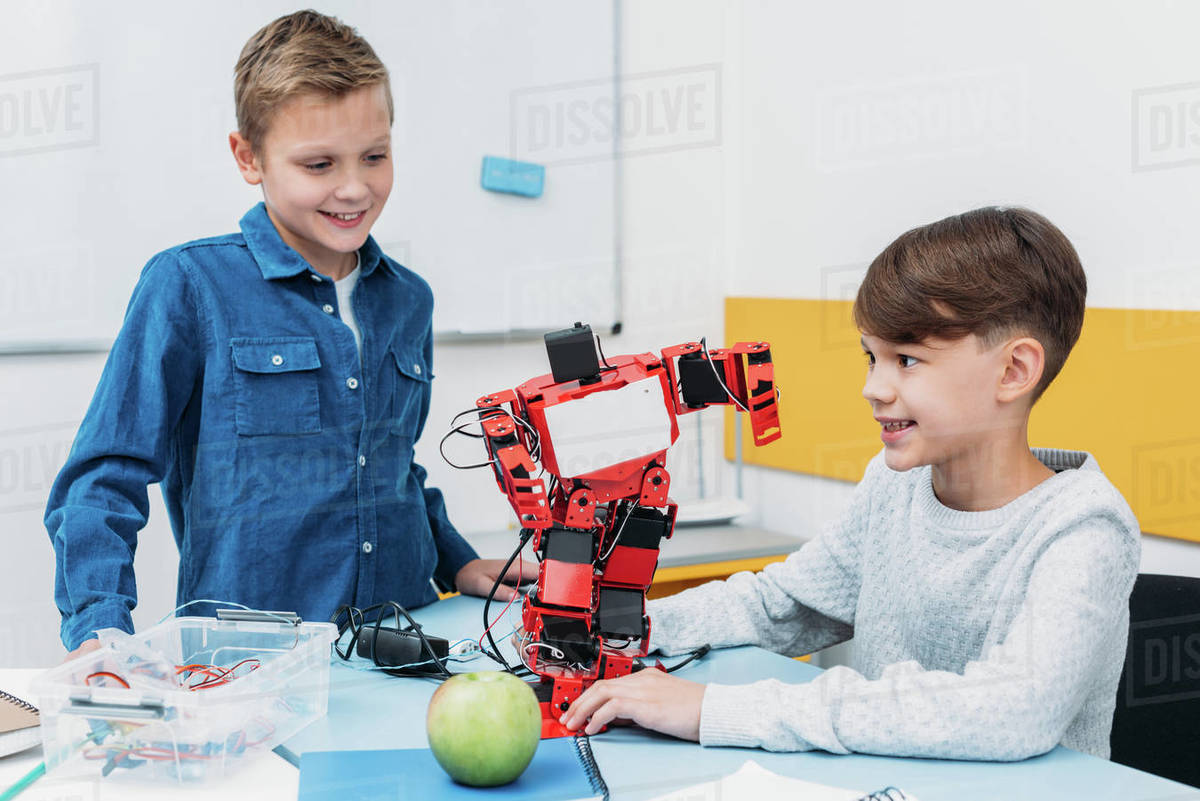 Schoolboys working on robot at stem robotics lesson - Royalty-free ...