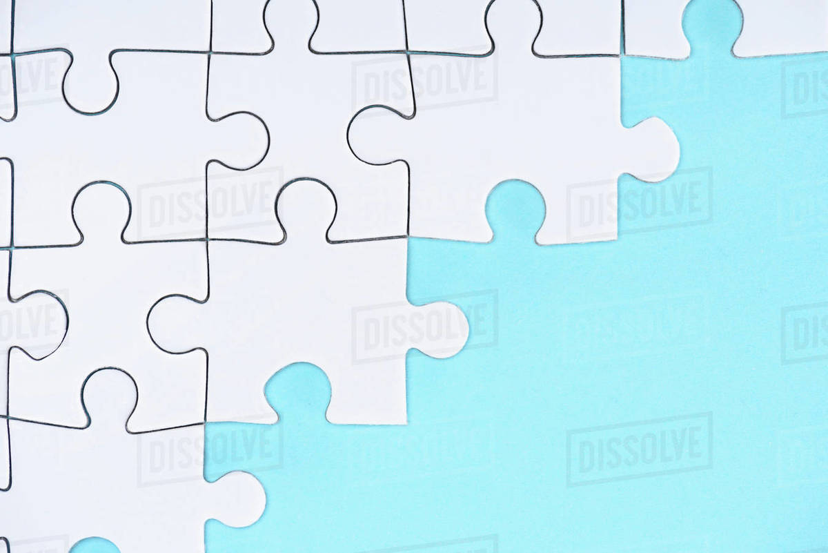 Top view of white puzzles arrangement on blue background - Stock Photo ...