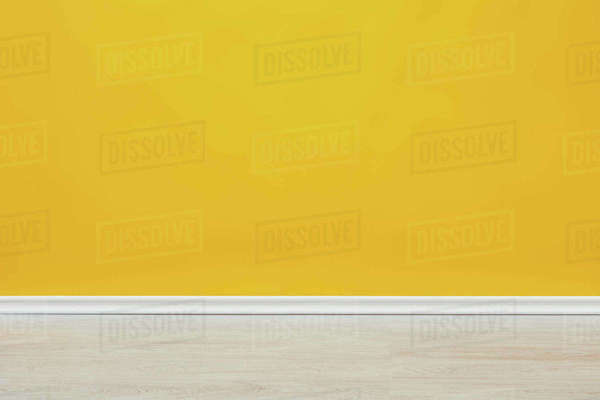 Background of bright empty yellow wall with wooden floor - Royalty-free ...