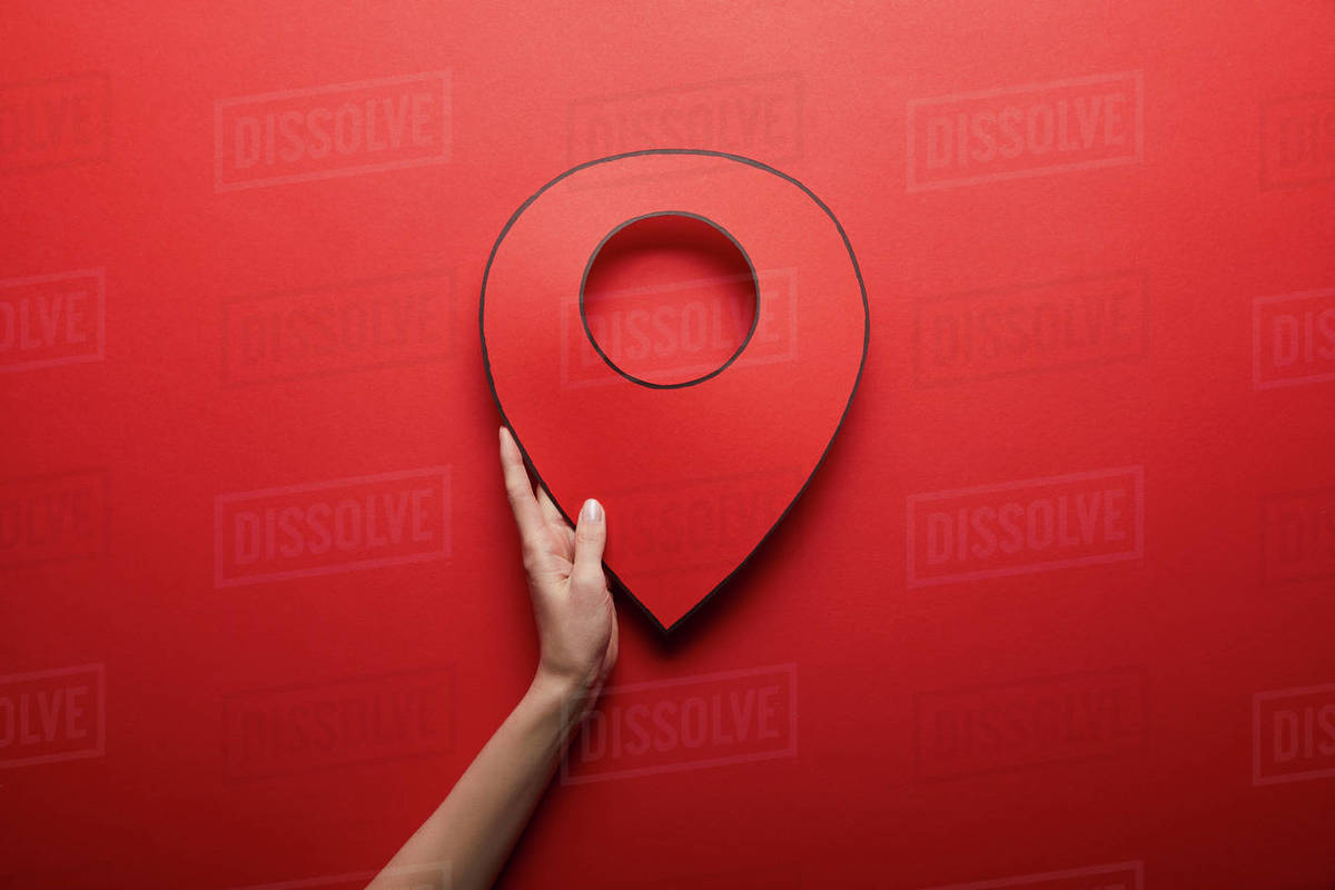 Top view of red handmade geolocation symbol on red background - Stock ...