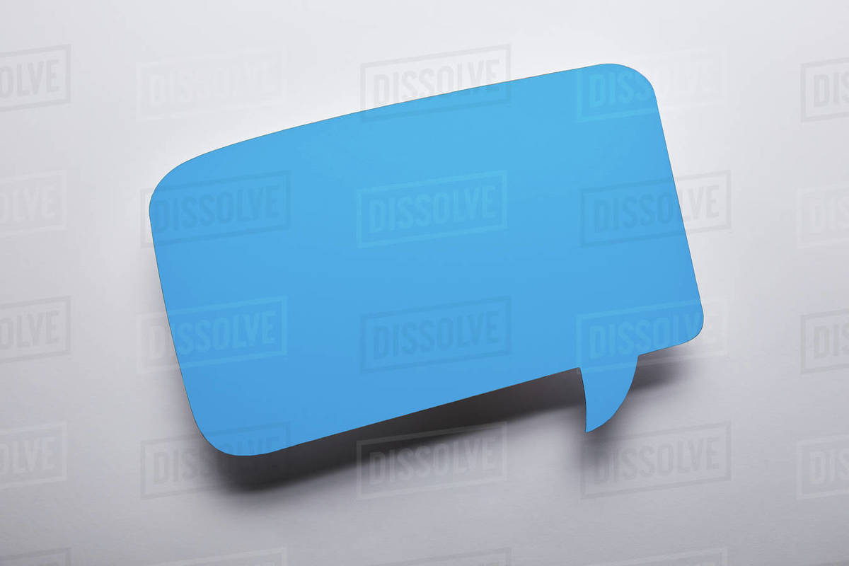 Top view of empty blue speech bubble on grey background - Stock Photo ...