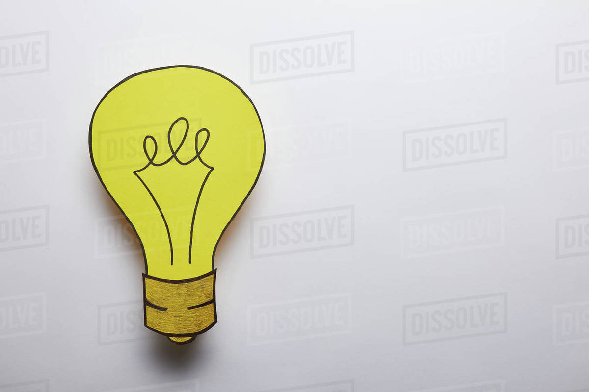 Top view of yellow light bulb idea symbol on grey background - Royalty ...