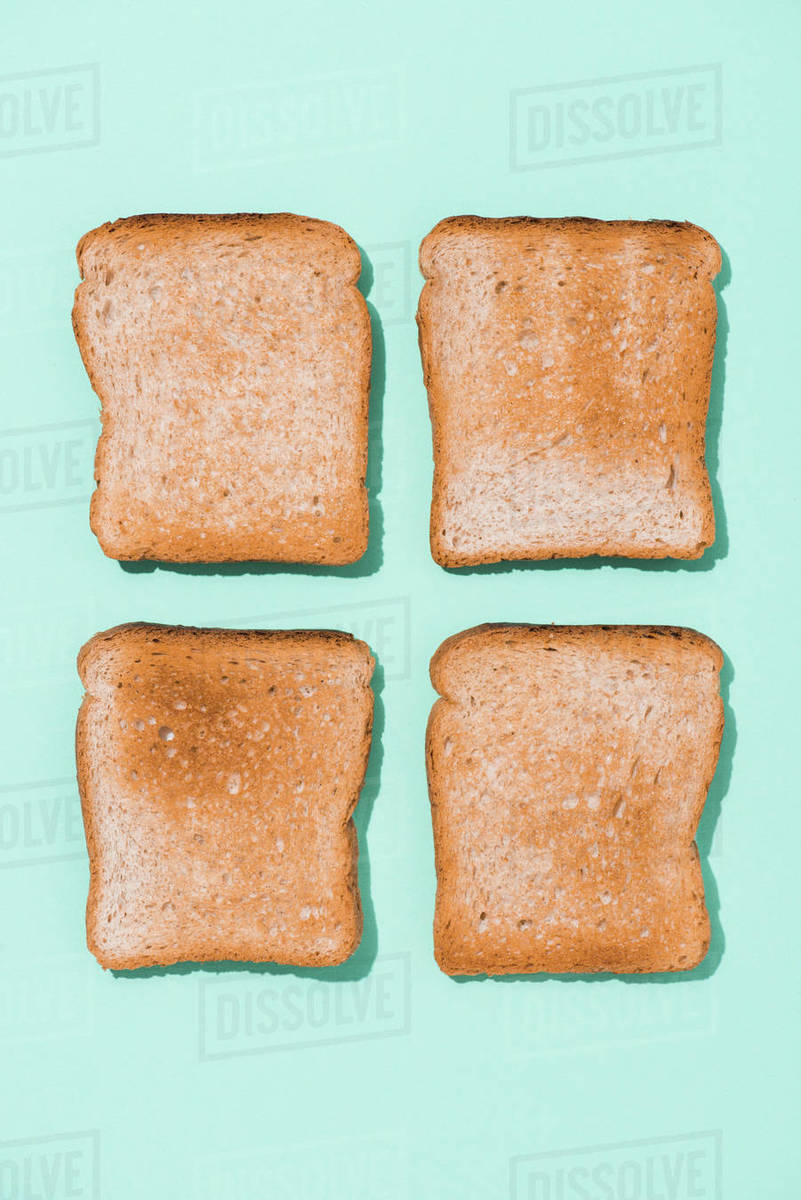 Top view of assembled crunchy toasts on blue surface - Royalty-free ...