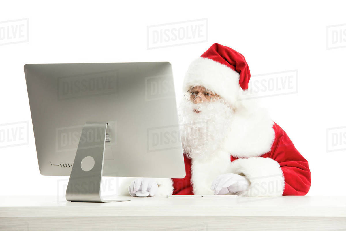 Portrait of Santa Claus working on computer isolated on white - Royalty ...