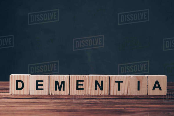 Wooden cubes with dementia letters on black background - Royalty-free ...