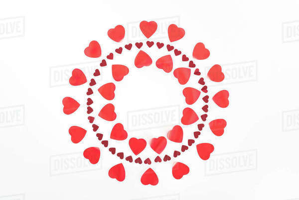 Top view of circles made of red heart symbols isolated on white, street ...