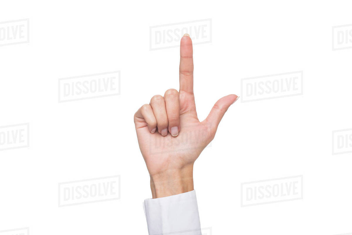Cropped view of person gesturing signed language or pointing up ...