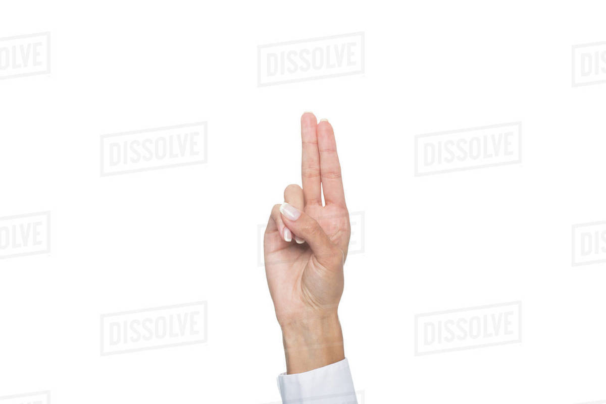 Cropped view of person gesturing signed language or pointing up ...