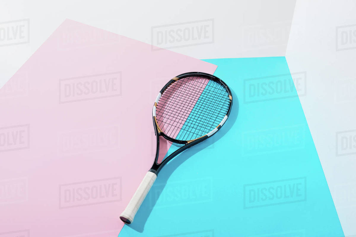 Tennis racket lying on blue and pink papers - Royalty-free Stock Photo ...