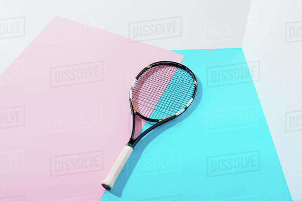 Tennis racket lying on blue and pink papers - Royalty-free Stock Photo ...