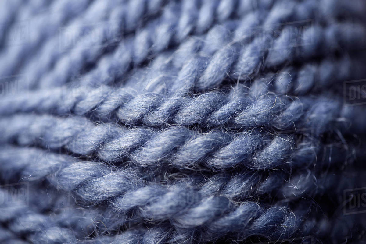 Full frame of purple yarn texture as background - Stock Photo - Dissolve