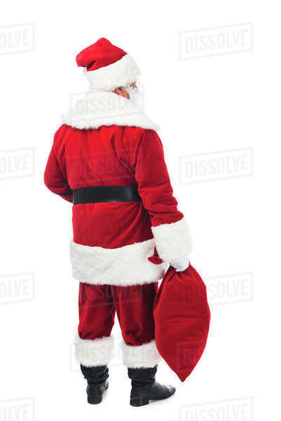back view of santa claus in traditional costume holding bag with ...