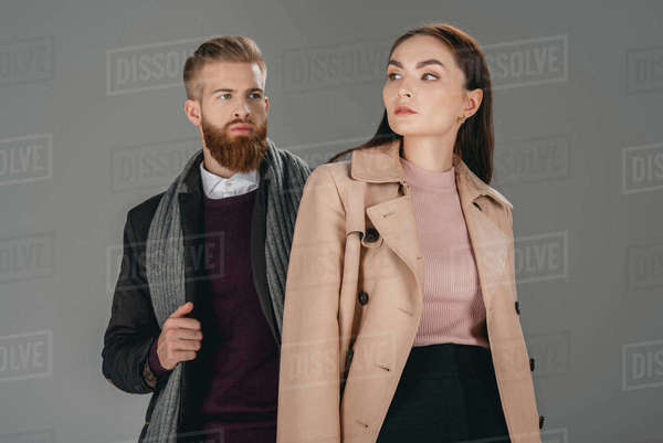 fashionable couple in autumn coat and jacket posing together isolated ...