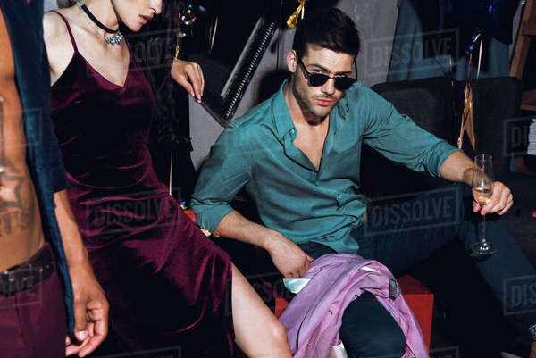 Handsome man with champagne glass on party with friends - Royalty-free ...