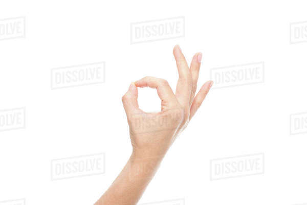 Partial view of hand showing ok sign isolated on white - Royalty-free ...