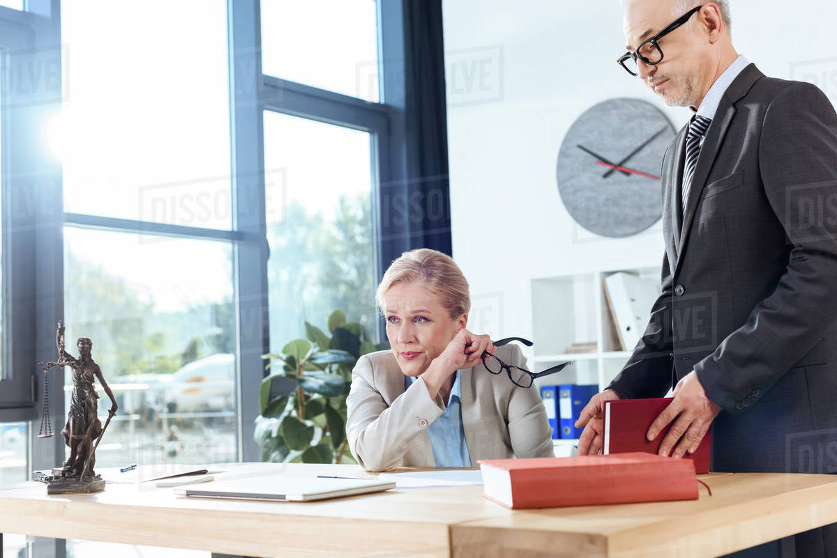 mature overworked colleagues at modern office - Royalty-free Stock ...
