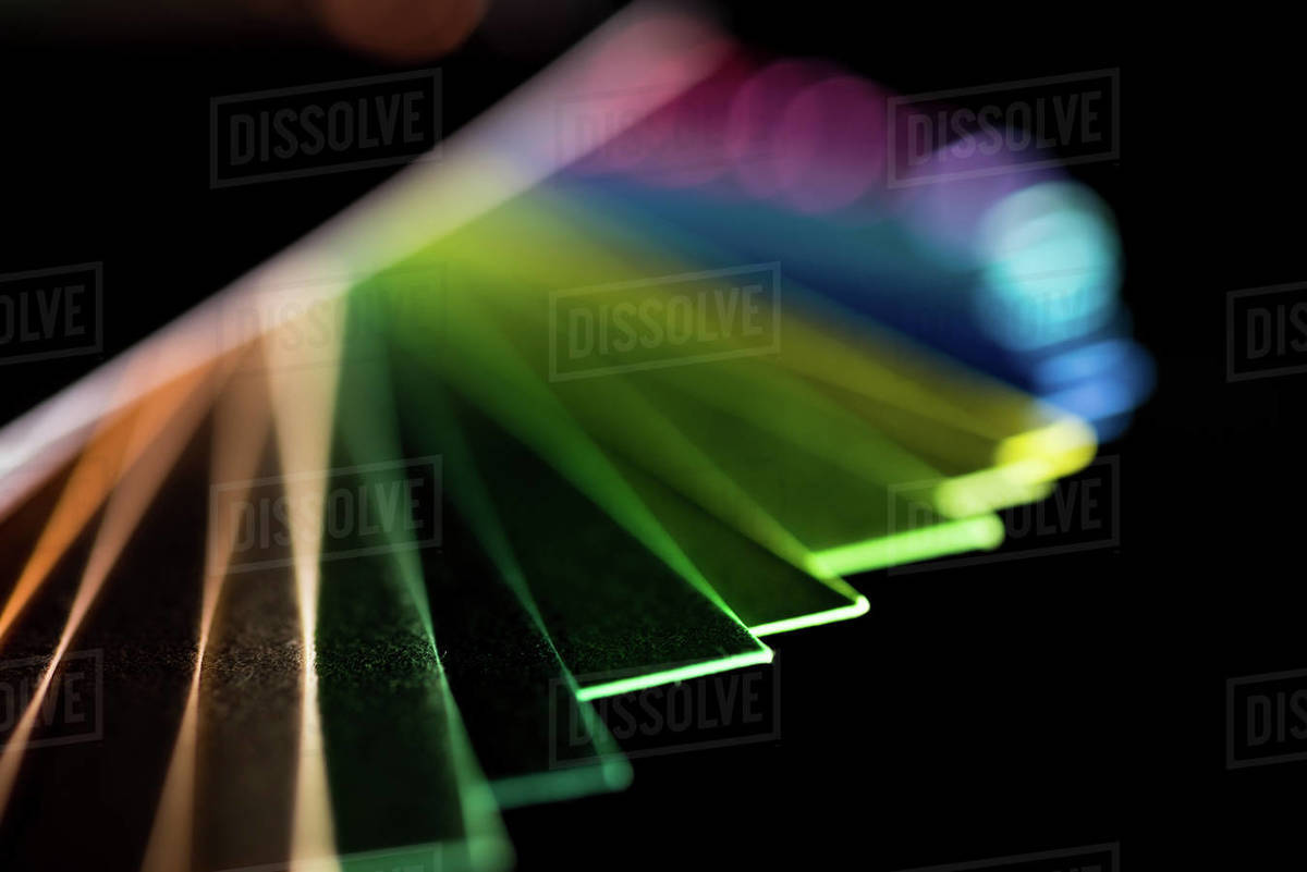 row of colorful papers isolated on black - Royalty-free Stock Photo ...