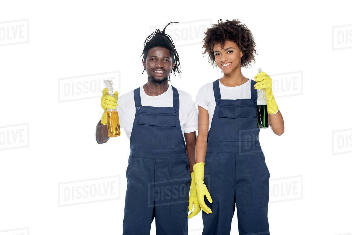 portrait of smiling african american cleaners in rubber gloves with ...