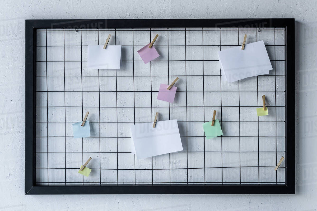various empty colorful notes hanging on board - Stock Photo - Dissolve