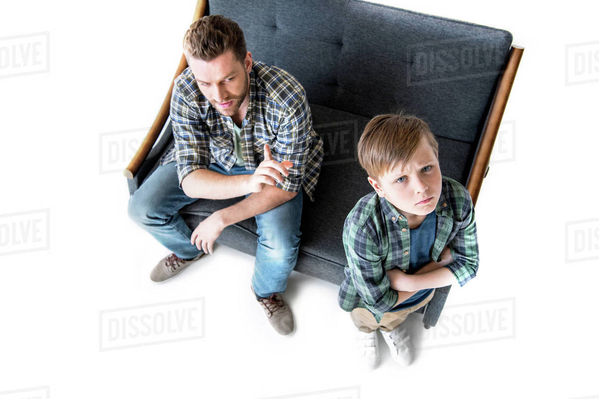 High angle view of father and son quarreling, family problems concept ...