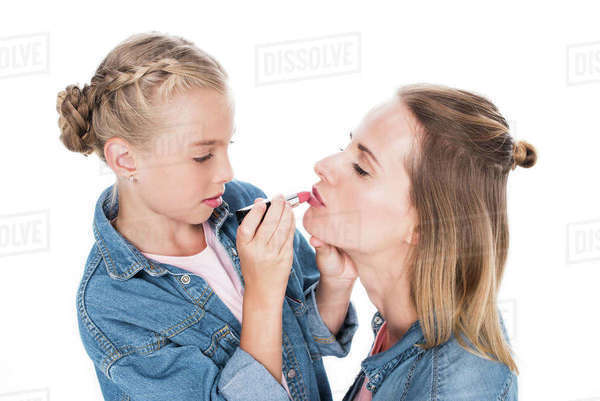 Mother and daughter applying makeup together, isolated on white - Stock ...