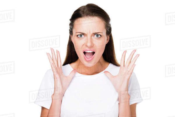 Portrait of young woman screaming while looking at camera isolated on ...
