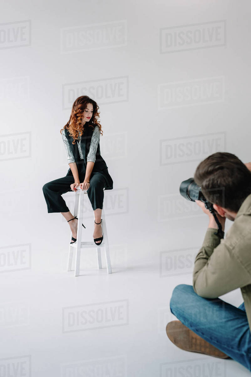 professional male photographer and attractive model on fashion shoot in ...