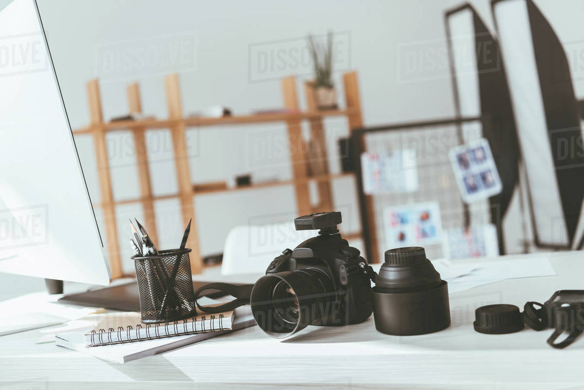 empty workspace with computer monitor and photo camera - Royalty-free ...