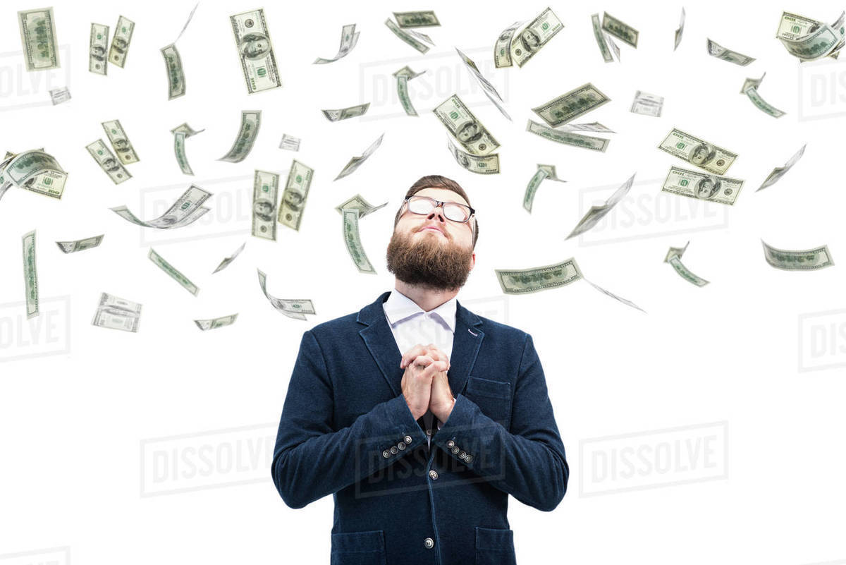 Businessman with falling dollar banknotes, isolated on white - Royalty ...
