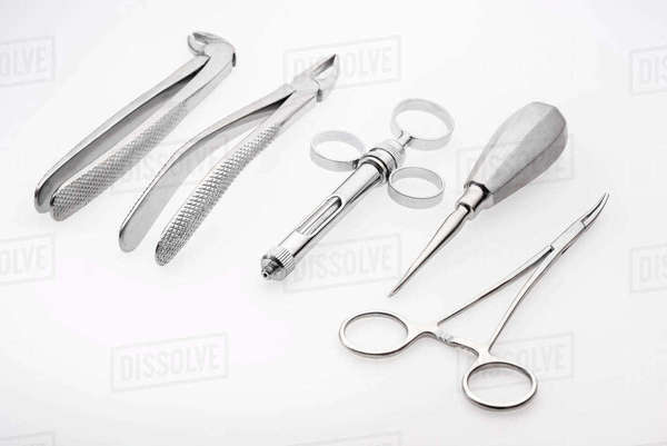 Close-up view of professional dental instruments isolated on white ...